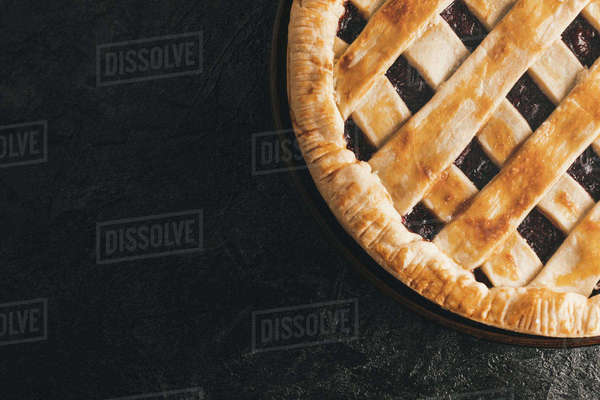 Top view of homemade pie isolated on black tabletop - Royalty-free ...