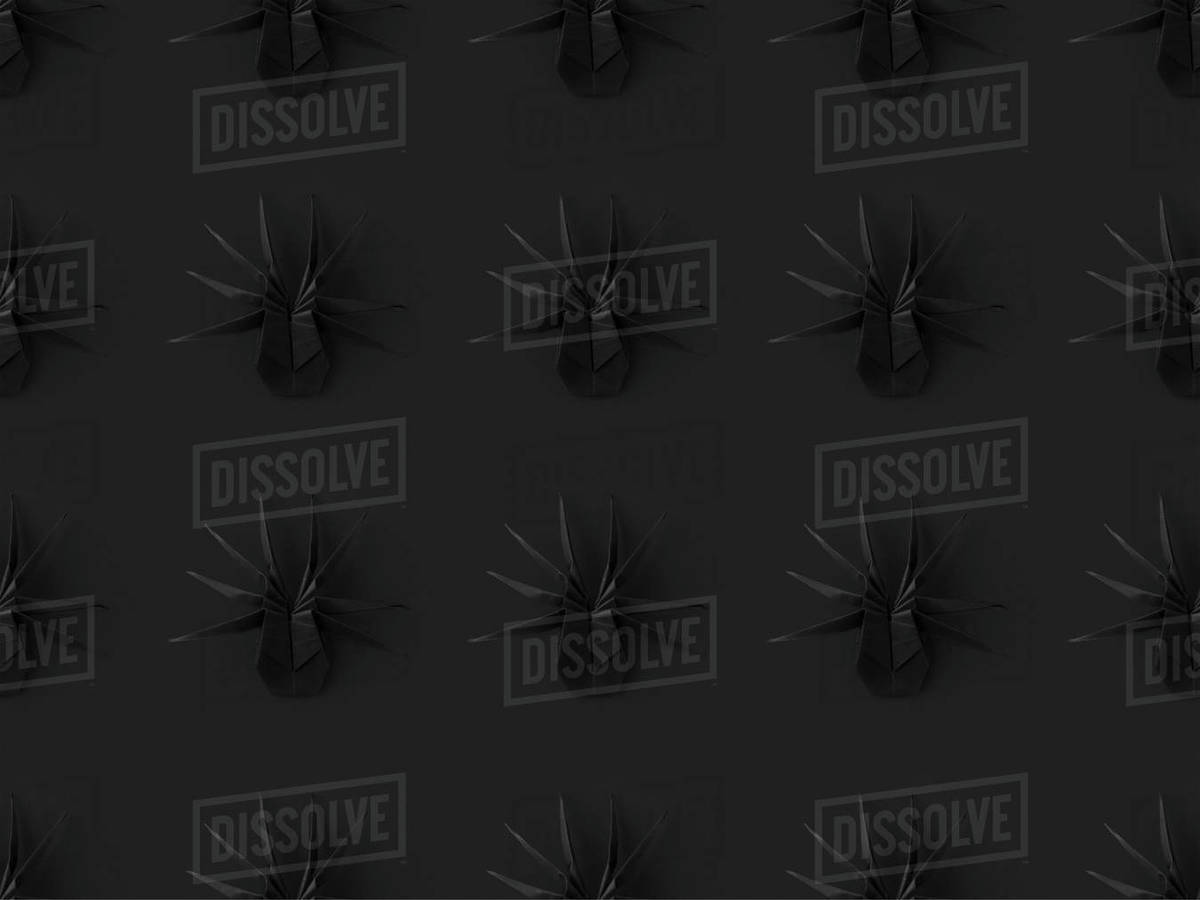 Halloween texture with black origami spiders, isolated on black ...