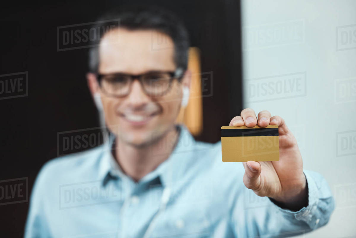 Businessman showing his credit card to camera - Royalty-free Stock ...