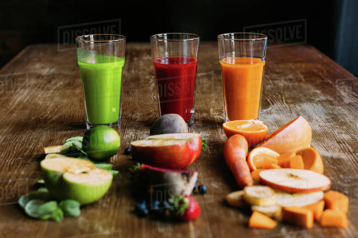 Close-up view of various organic fruit and vegetable smoothies with ...