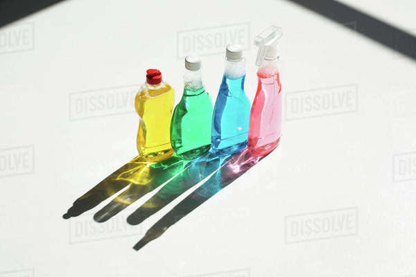 High angle view of various plastic bottles with colorful cleaning ...