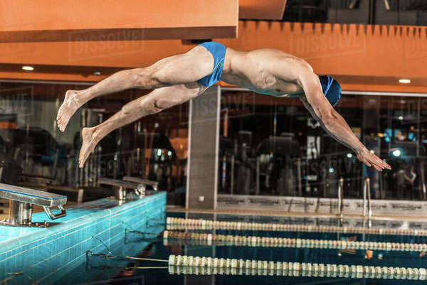 Swimmer diving into competition swimming pool - Royalty-free Stock ...