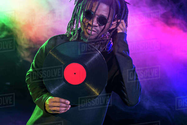 Professional African American club dj with vinyl in nightclub - Royalty ...
