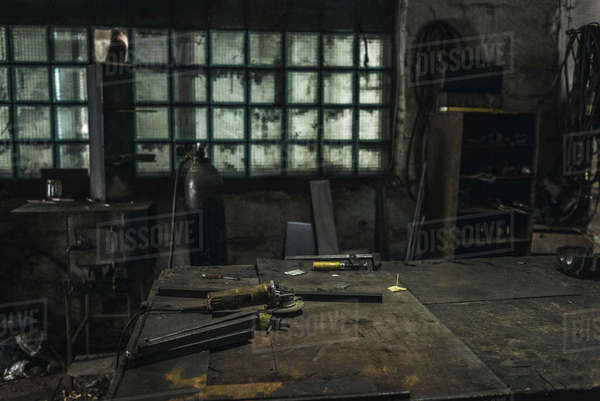 Empty welder workplace with various supplies in workshop - Royalty-free ...