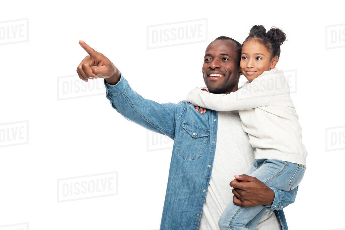 happy african american father and daughter pointing with finger and ...