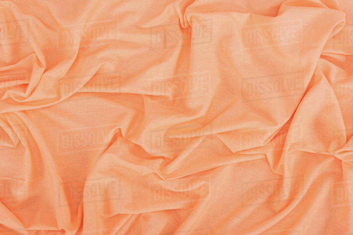 close up view of orange linen fabric texture - Stock Photo - Dissolve