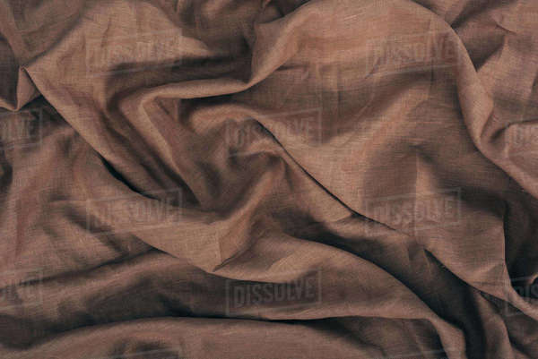 close up view of brown linen fabric texture - Stock Photo - Dissolve