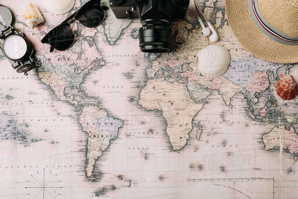 Top view of film camera with sunglasses and compass on a map - Royalty ...