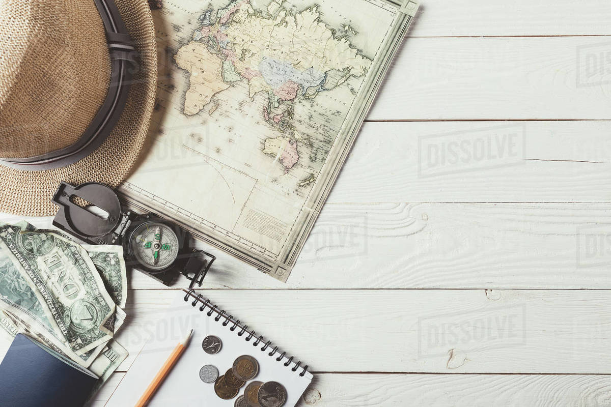 Top view of travel stuff on a white wooden table. Journey concept ...