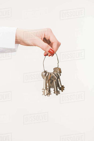 cropped image of female hand holding keys isolated on white - Stock ...
