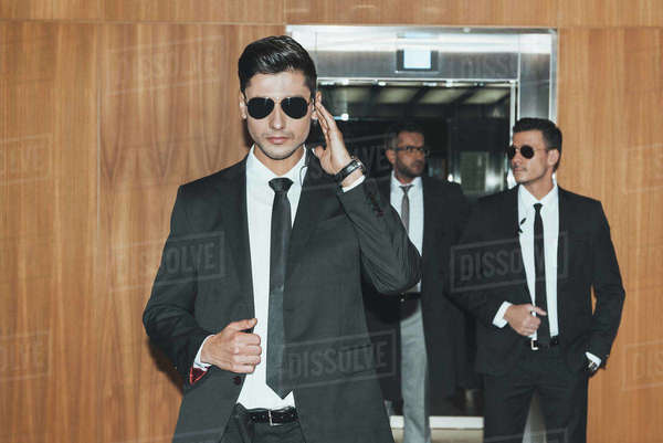 Bodyguard listening information with security earpiece - Stock Photo ...