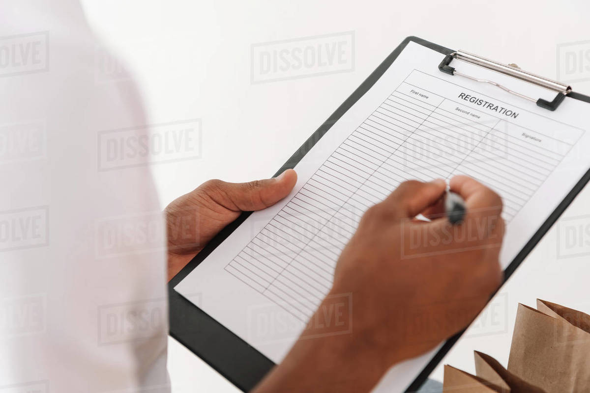 Cropped shot of man filling in registration form - Royalty-free Stock ...