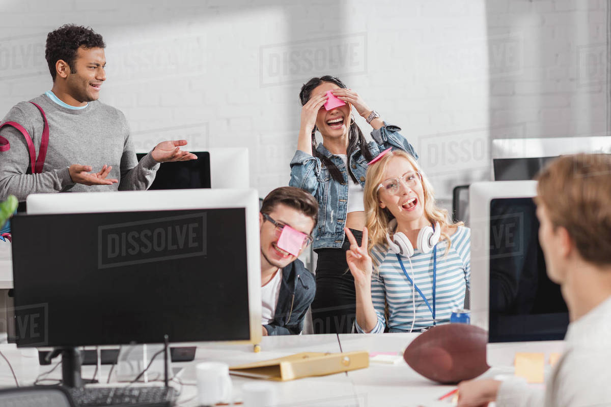 People having fun at modern office - Stock Photo - Dissolve