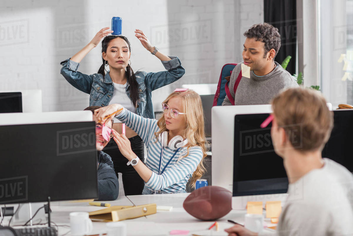 People having fun at modern office - Stock Photo - Dissolve
