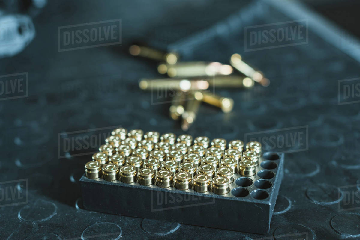 Close up view of bullets in stand on table - Royalty-free Stock Photo ...