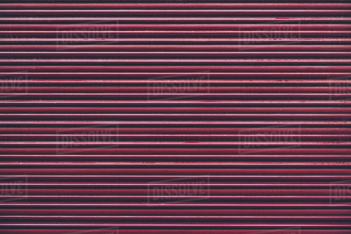 Red horizontally striped wall for background - Stock Photo - Dissolve