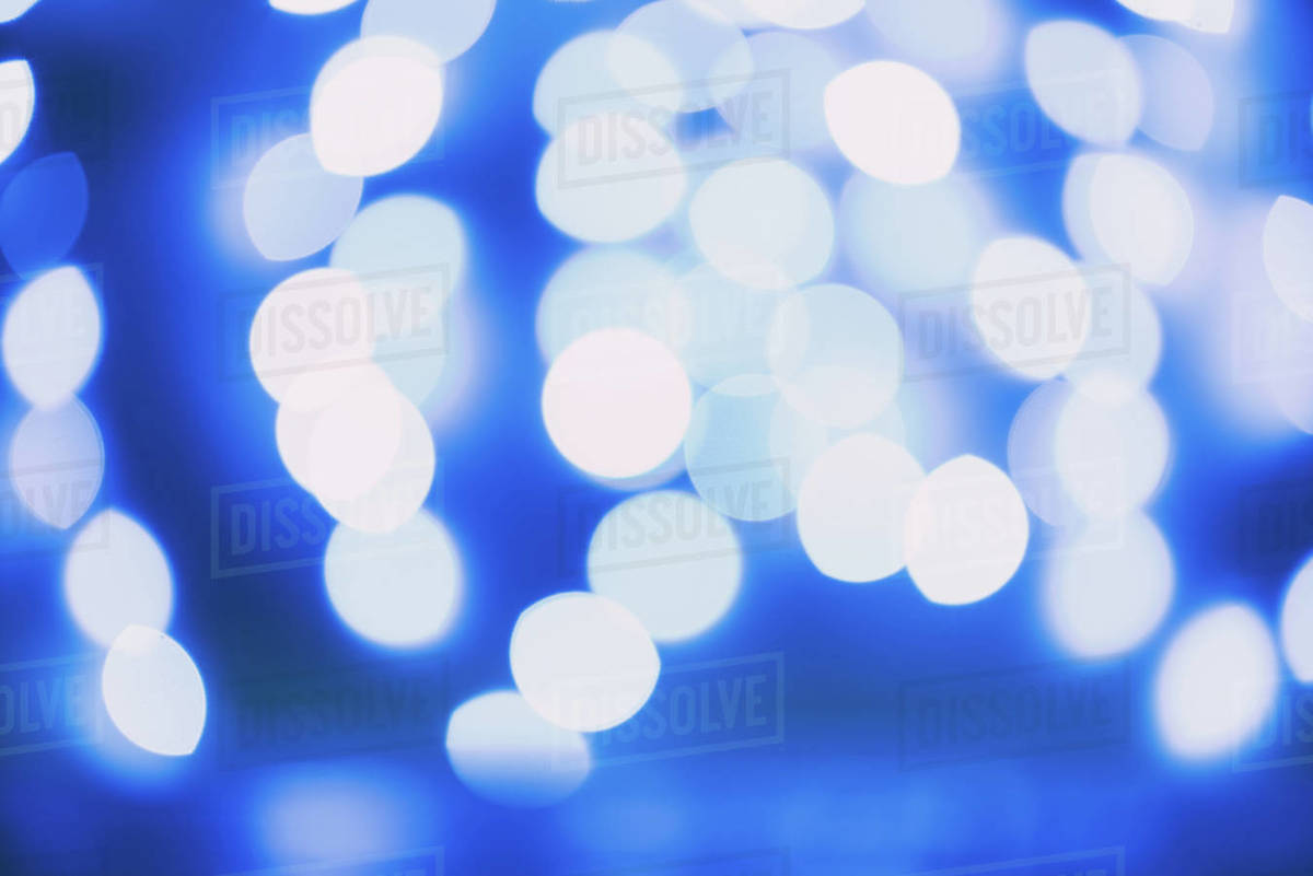 Background with unfocused bokeh blue lights - Stock Photo - Dissolve