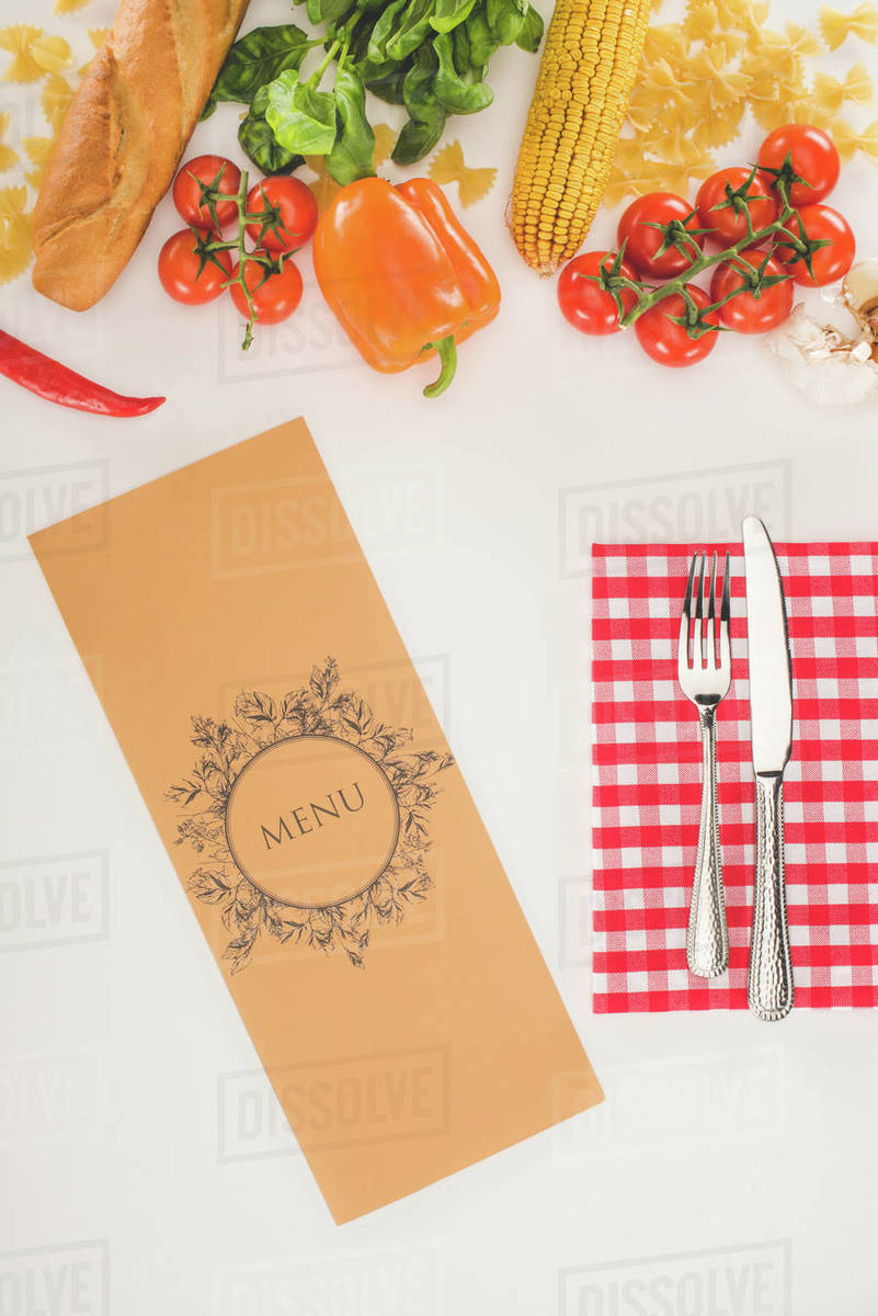 Top view of decorative menu, cutlery and ingredients on white - Stock ...