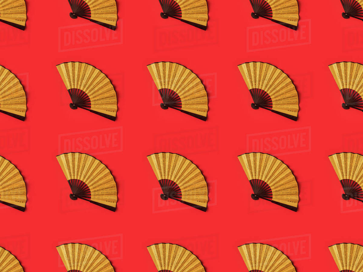 Top view of decorative oriental fans pattern isolated on red - Royalty ...