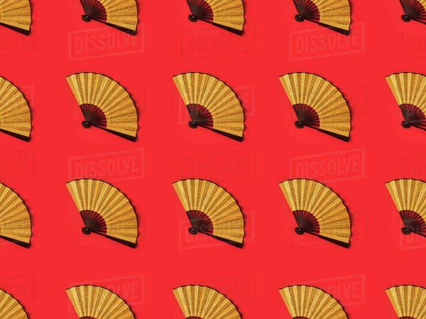 Top view of decorative oriental fans pattern isolated on red - Royalty ...