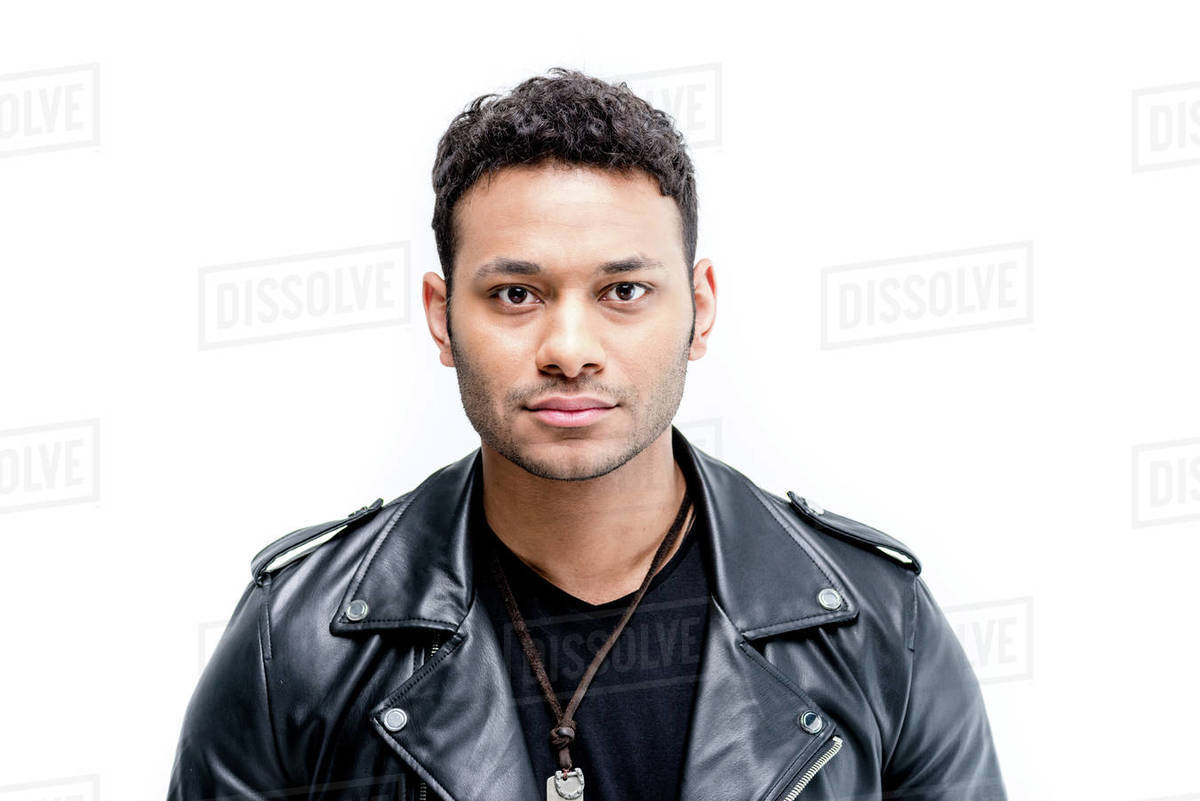 Portrait of African American rocker in black leather jacket posing ...