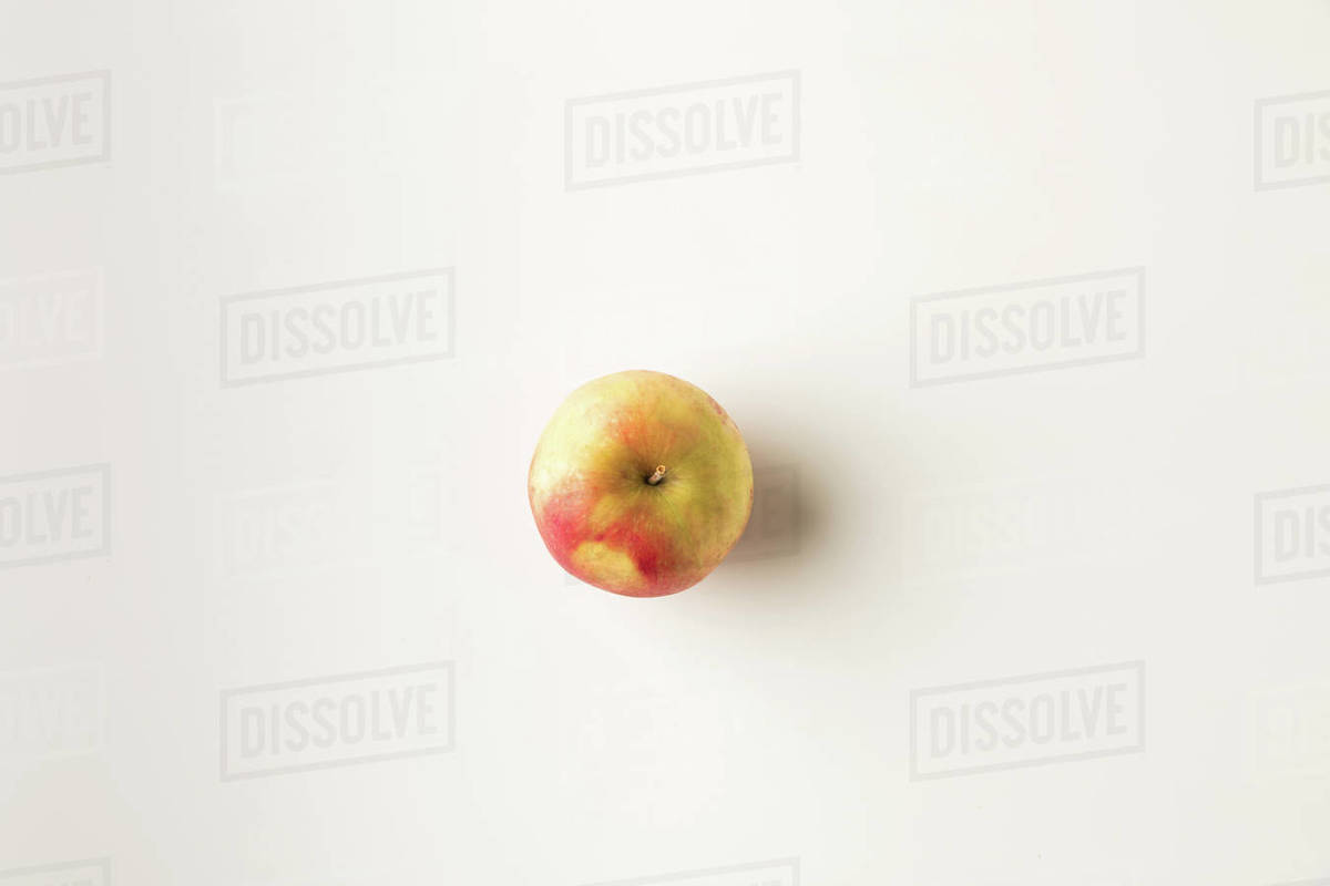 Top view of fresh ripe apple on white - Royalty-free Stock Photo | Dissolve