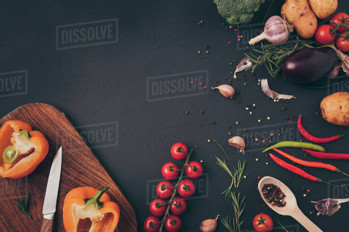 Top view of vegetable ingredients for dish on gray table - Stock Photo ...