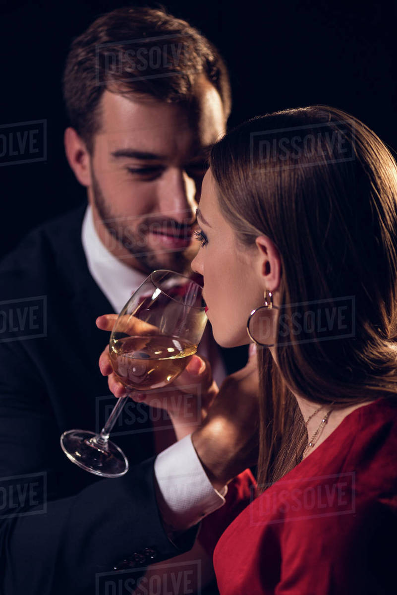 Couple drinking white wine on romantic date in restaurant - Royalty ...