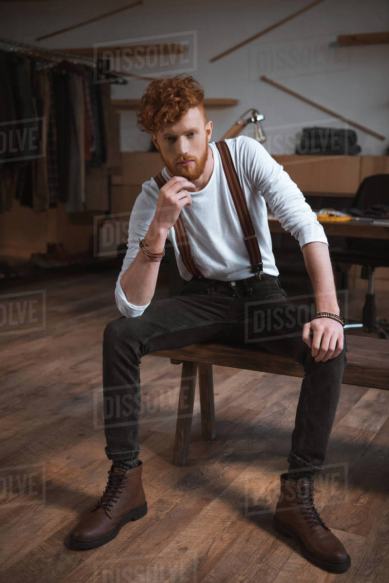 Full length view of handsome stylish young male fashion designer ...