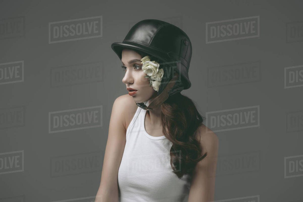 beautiful young girl in military helmet with white roses, isolated on grey - Royalty-free Stock ...