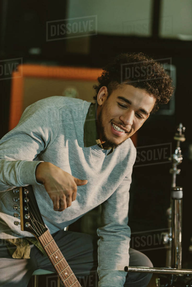 handsome happy musician with electric guitar at studio - Stock Photo ...