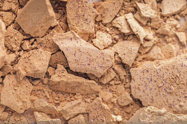 Top view of crushed cosmetic powder as background - Stock Photo - Dissolve
