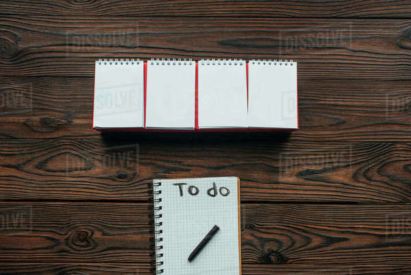 Top view of blank calendar and notebook with to do lettering on wooden ...