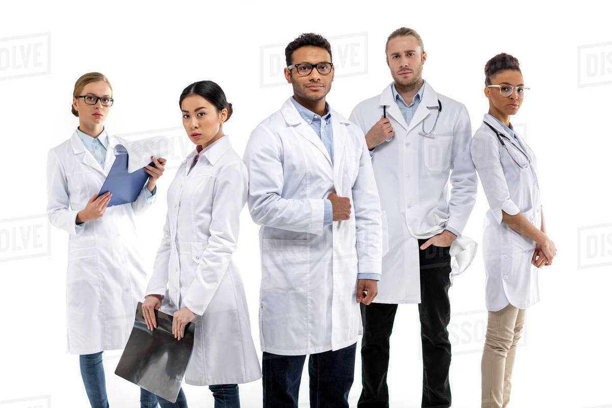 Group of young confident professional doctors standing together ...
