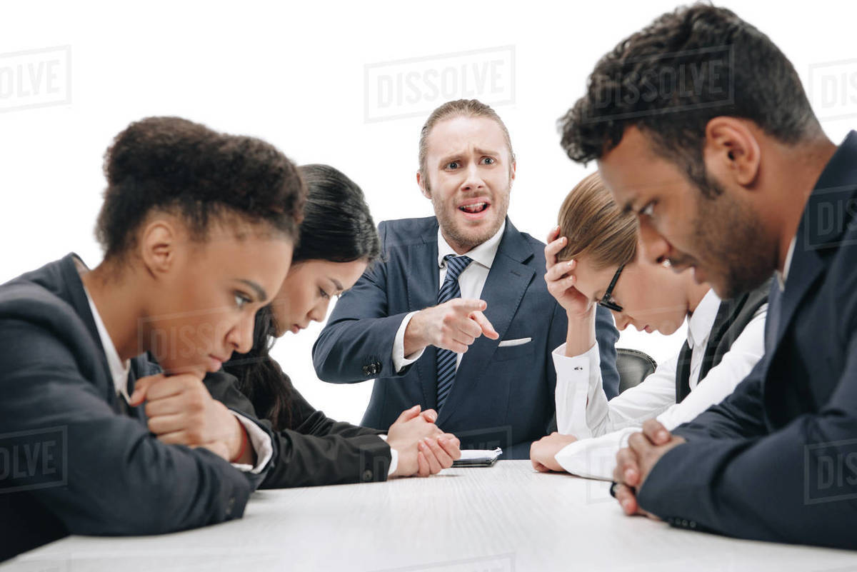 Angry businessman quarreling at guilty colleagues, isolated on white ...
