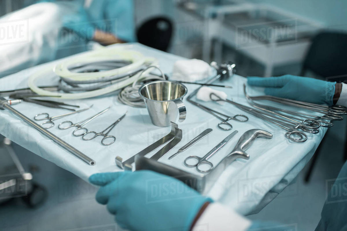 Cropped image of african american doctor holding tray with medical ...