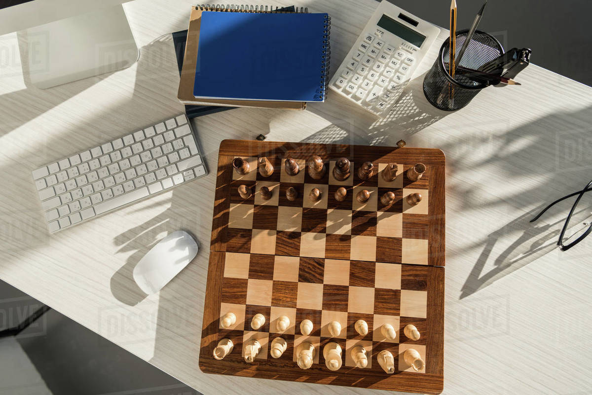 flat lay chess board at workplace with computer keyboard - Royalty-free ...