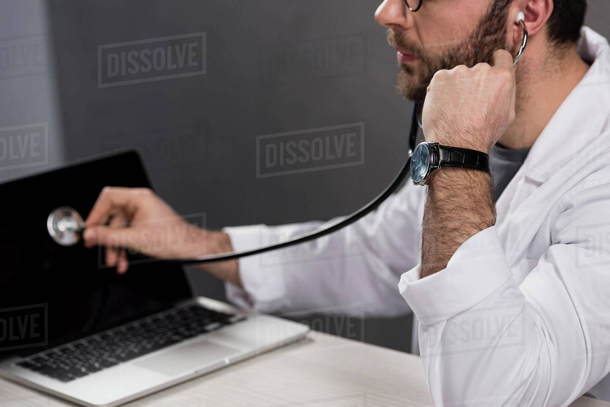 Cropped image of repairman in doctor white coat and stethoscope ...