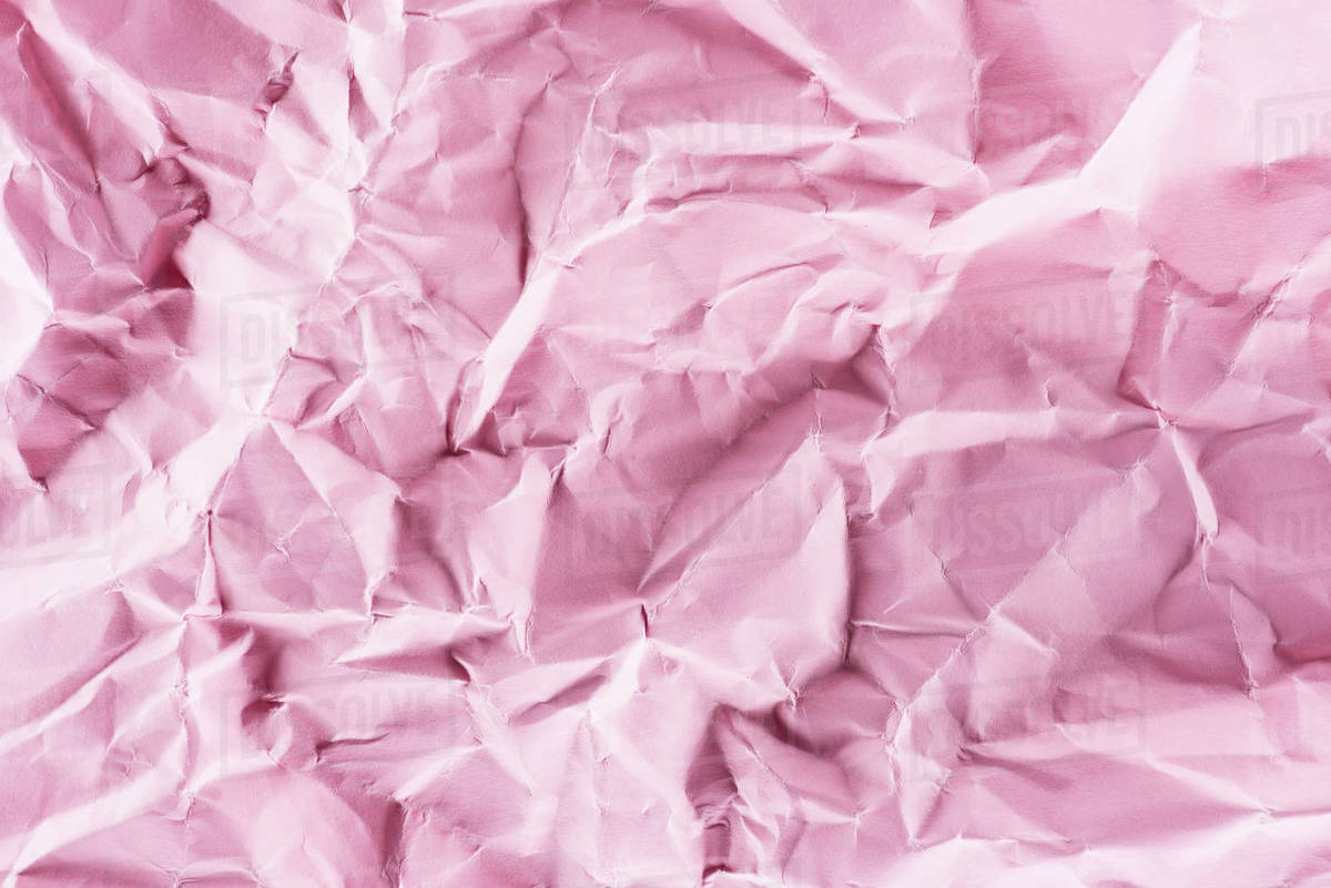 Close-up shot of crumpled pink paper for background - Stock Photo ...