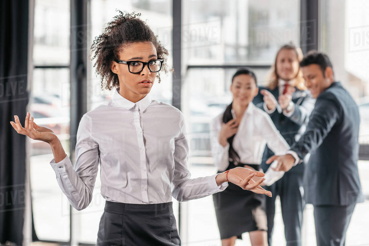 African american businesswoman with shrug gesture, businesspeople ...