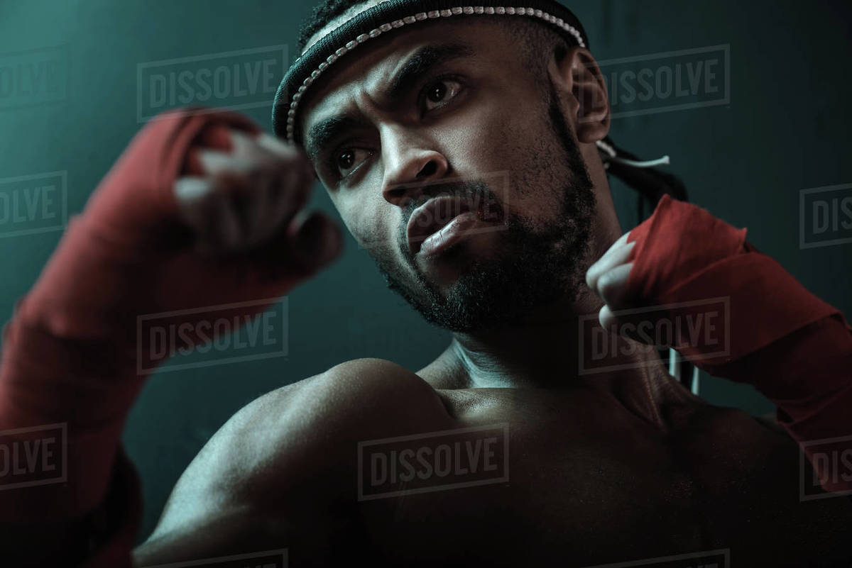 Close-up portrait of aggressive young muay thai boxer training thai ...