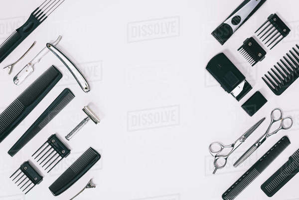 Top view of arrangement of various barber tools isolated on grey ...