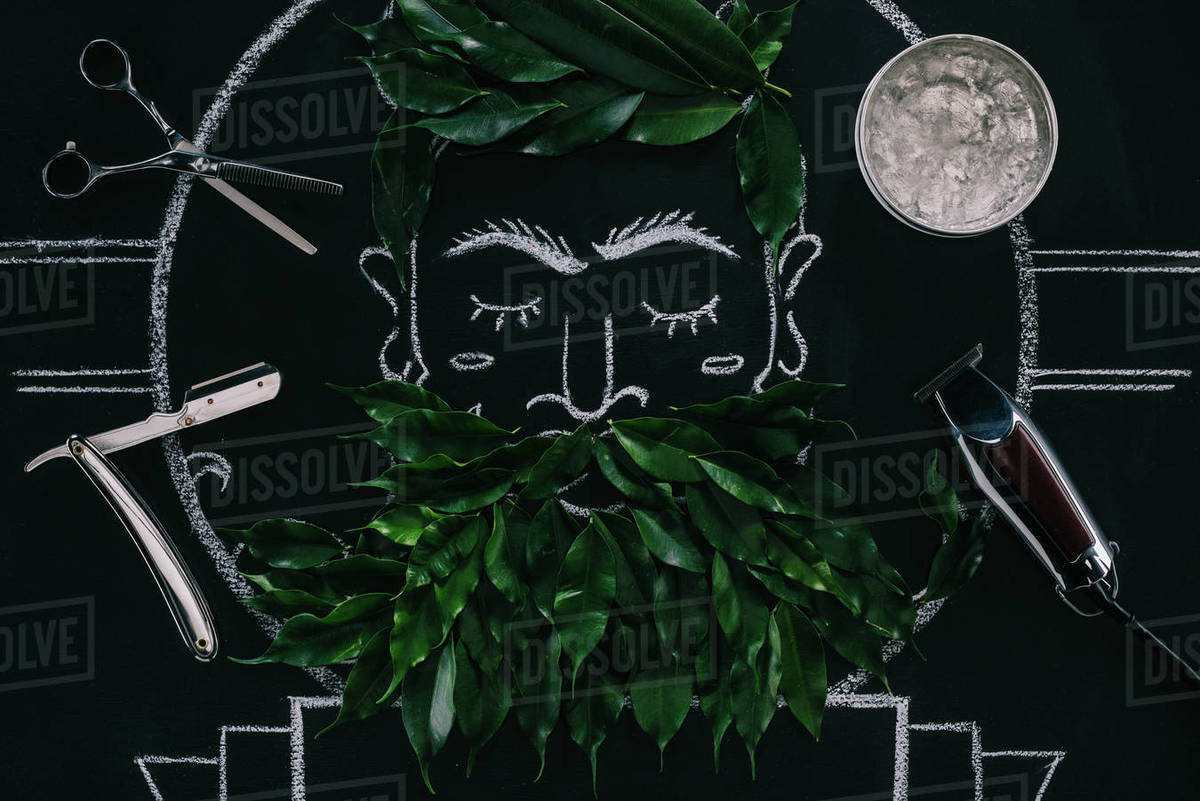 Top view of arranged ice cubes in bowl, scissors, razor and drawn ...