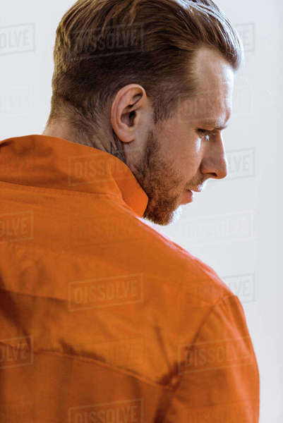 back view of prisoner in orange uniform - Royalty-free Stock Photo ...