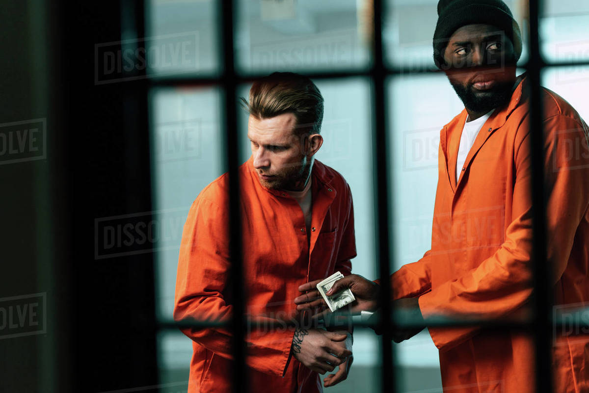 prisoner buying drugs at african american inmate in prison room ...