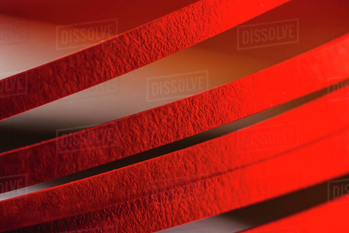 Close up view of red quilling striped paper - Stock Photo - Dissolve
