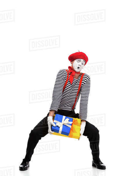 Mime holding heavy gift boxes isolated on white - Royalty-free Stock ...