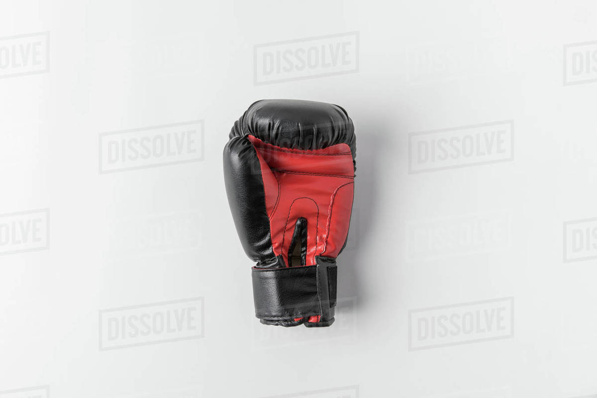 top view of boxing glove on white surface - Stock Photo - Dissolve