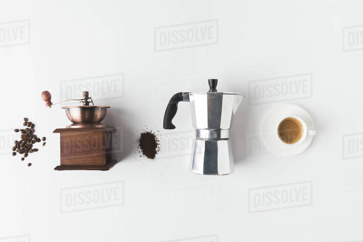 top view of arranged coffee making supplies, ingredients and cup of ...