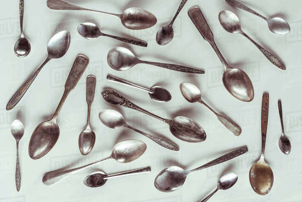Vintage metal spoons on white background - Royalty-free Stock Photo ...